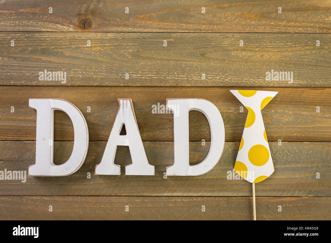 White letters DAD on a painted wood background Stock Photo - Alamy