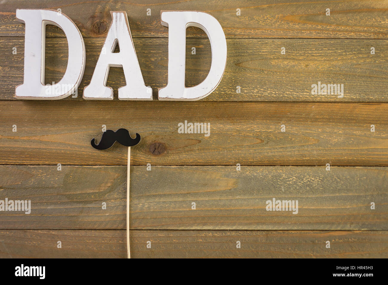 White letters DAD on a painted wood background Stock Photo - Alamy