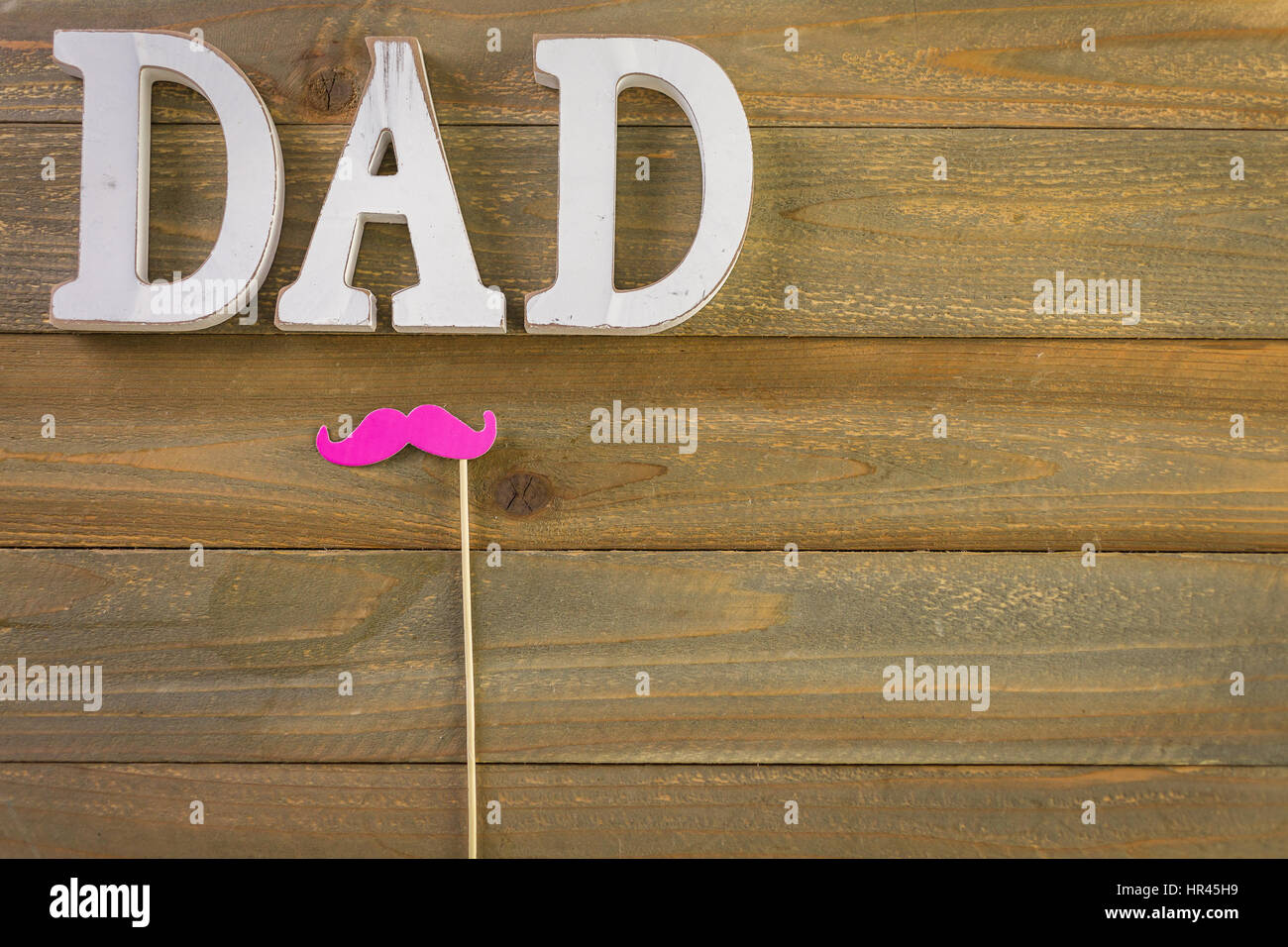 White letters DAD on a painted wood background Stock Photo - Alamy