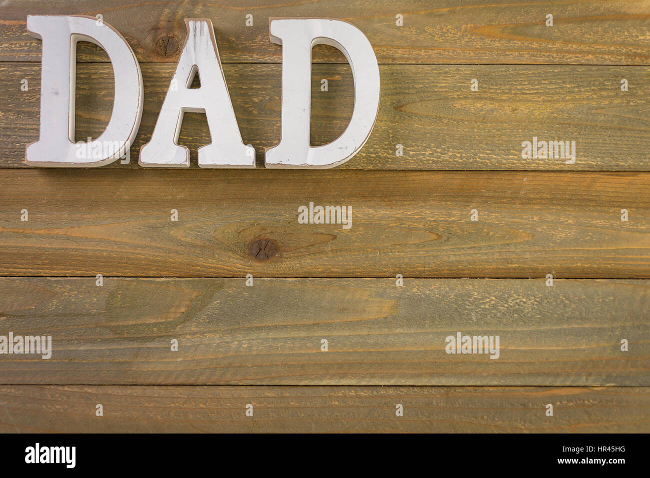 White letters DAD on a painted wood background Stock Photo - Alamy