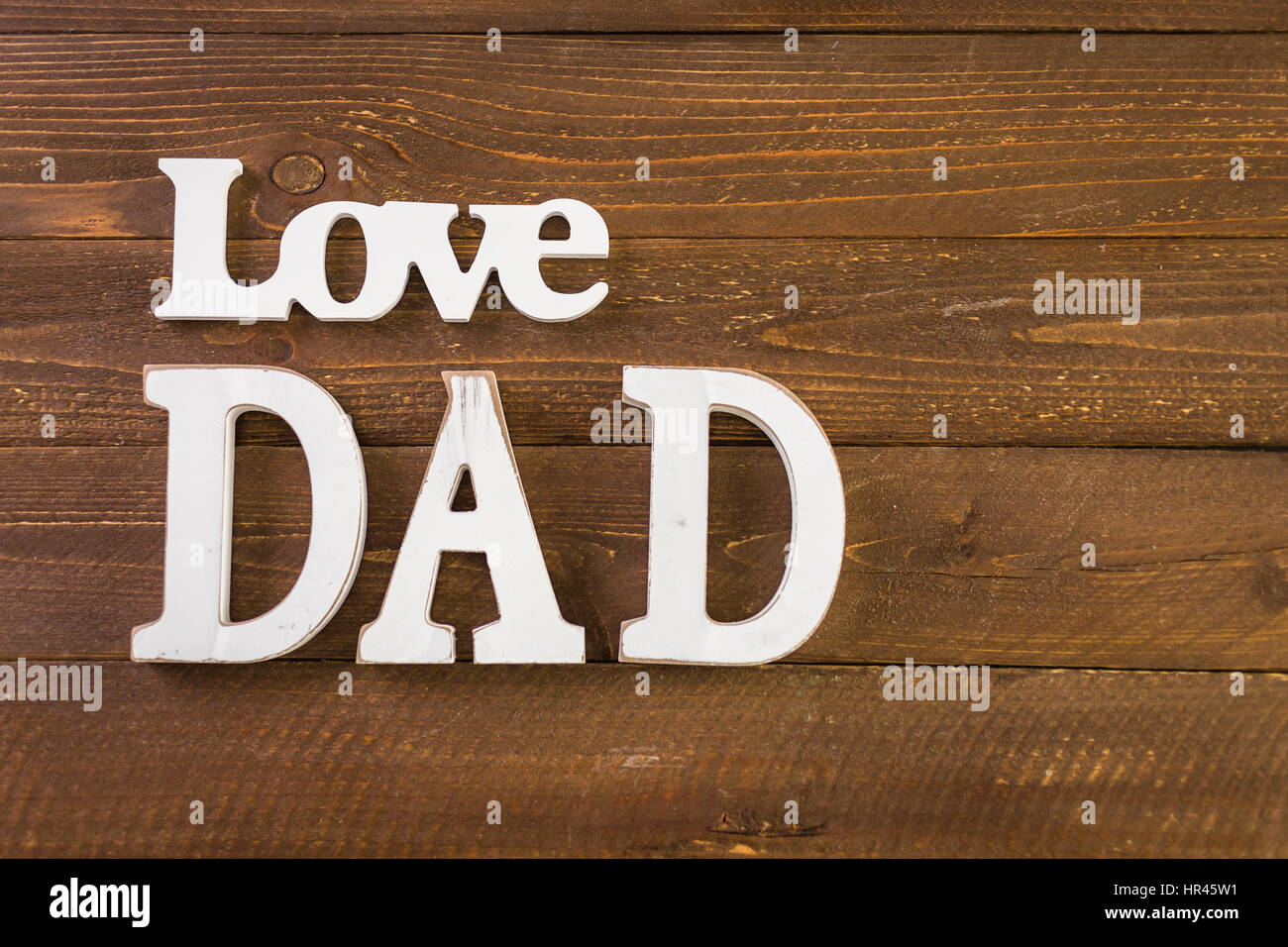 White letters DAD on a painted wood background Stock Photo - Alamy