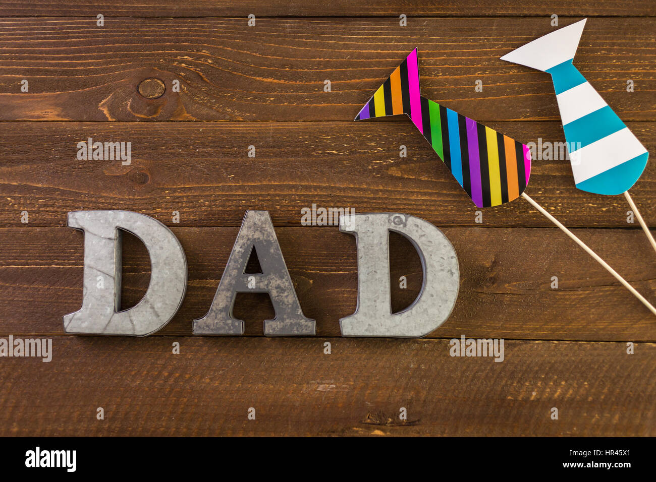 Metal letters DAD on a painted wood background Stock Photo - Alamy
