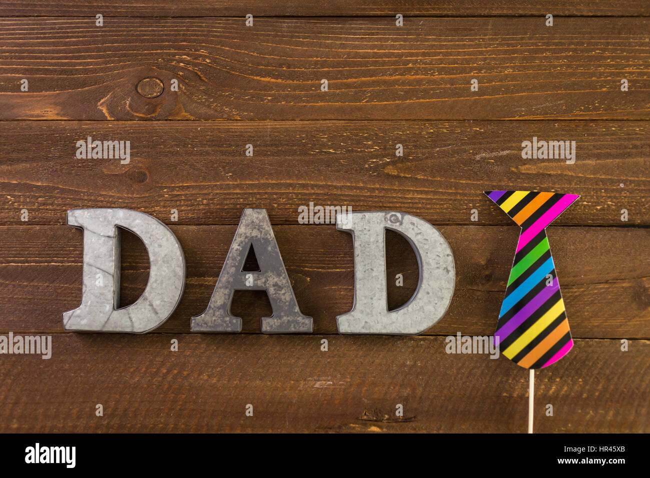 Metal letters DAD on a painted wood background Stock Photo - Alamy