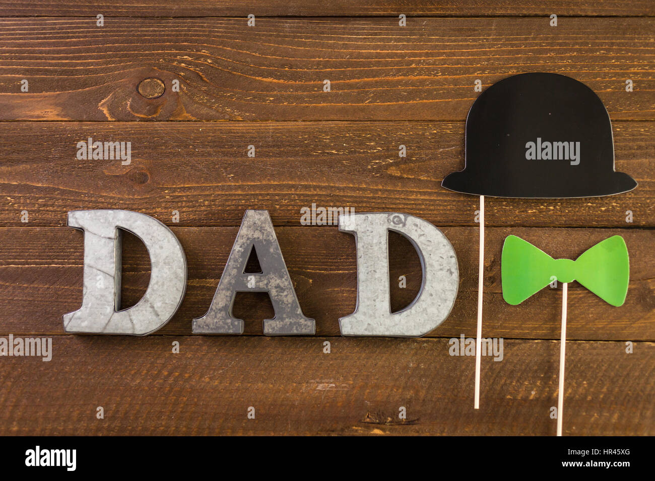 Metal letters DAD on a painted wood background Stock Photo - Alamy