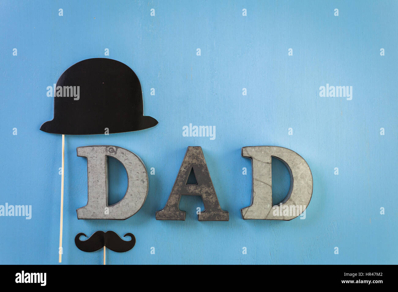Metal letters DAD on a painted wood background Stock Photo - Alamy