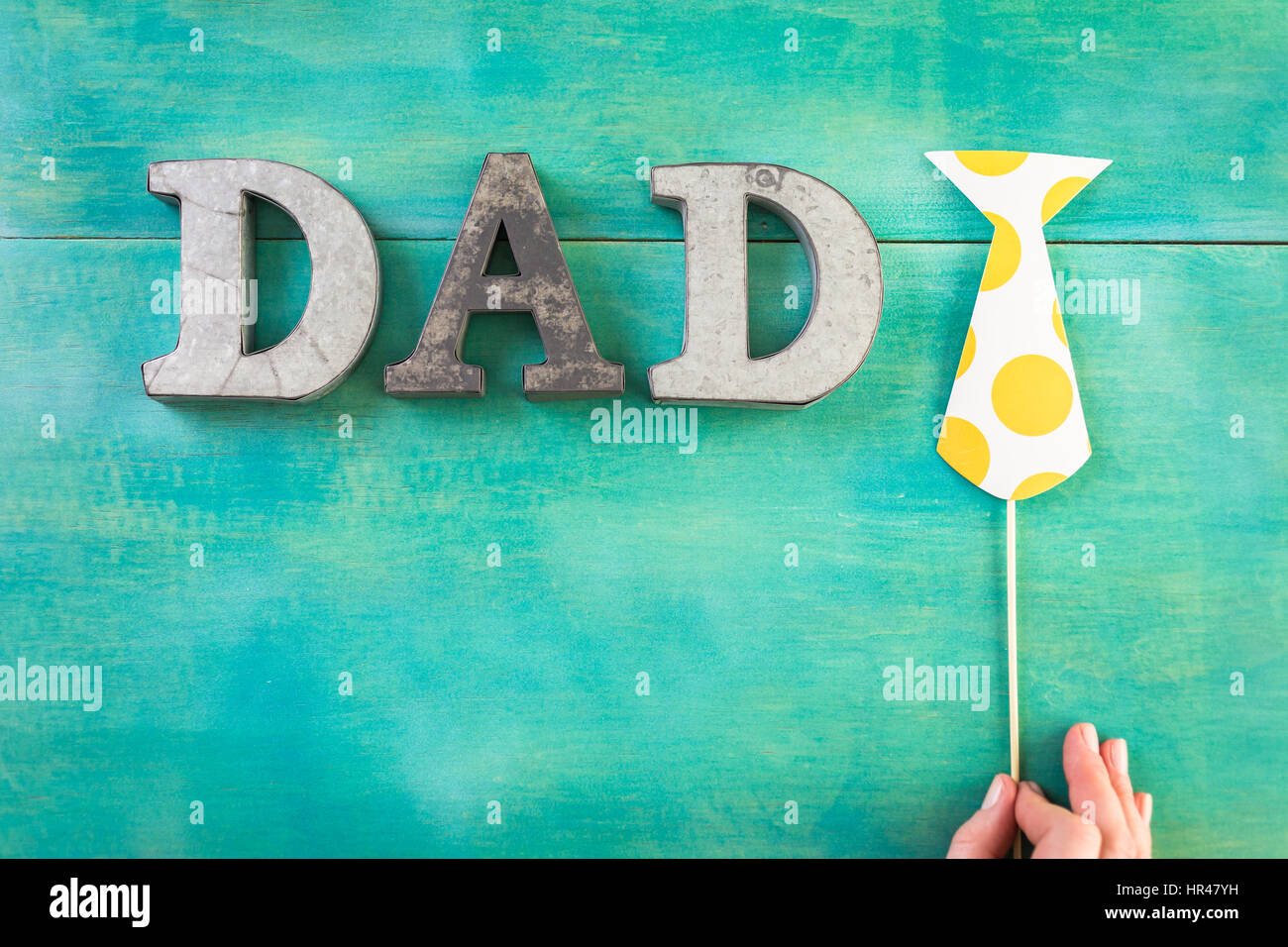 Metal letters DAD on a painted wood background Stock Photo - Alamy