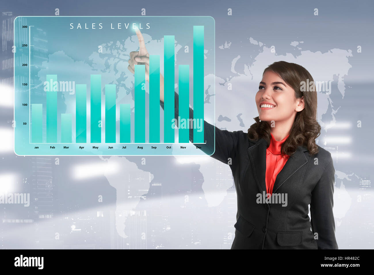 Asian business woman touching marketing sales income levels chart on ...