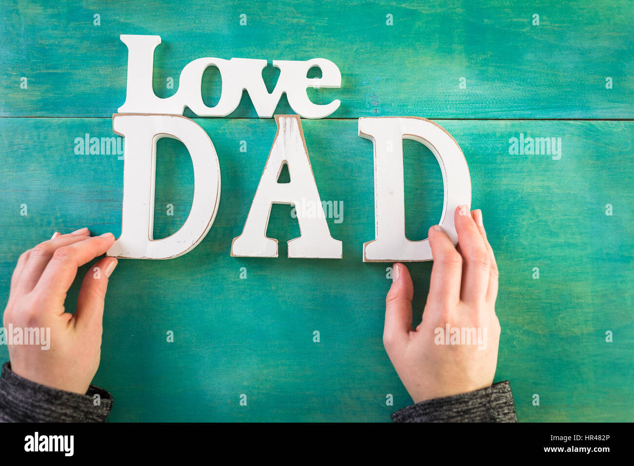 White letters DAD on a painted wood background Stock Photo - Alamy