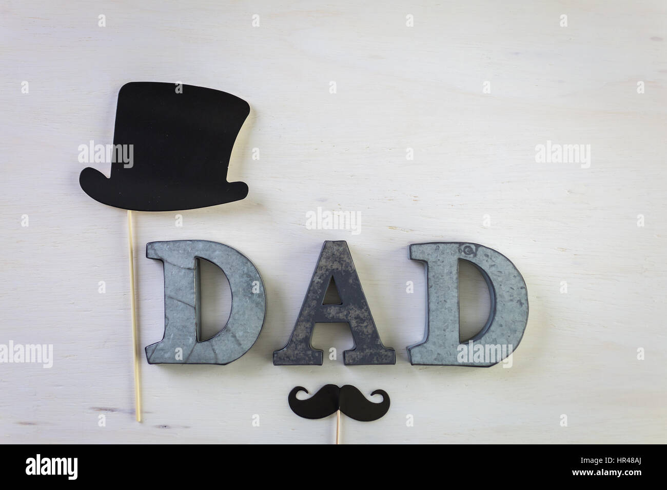 Metal letters DAD on a painted wood background Stock Photo - Alamy