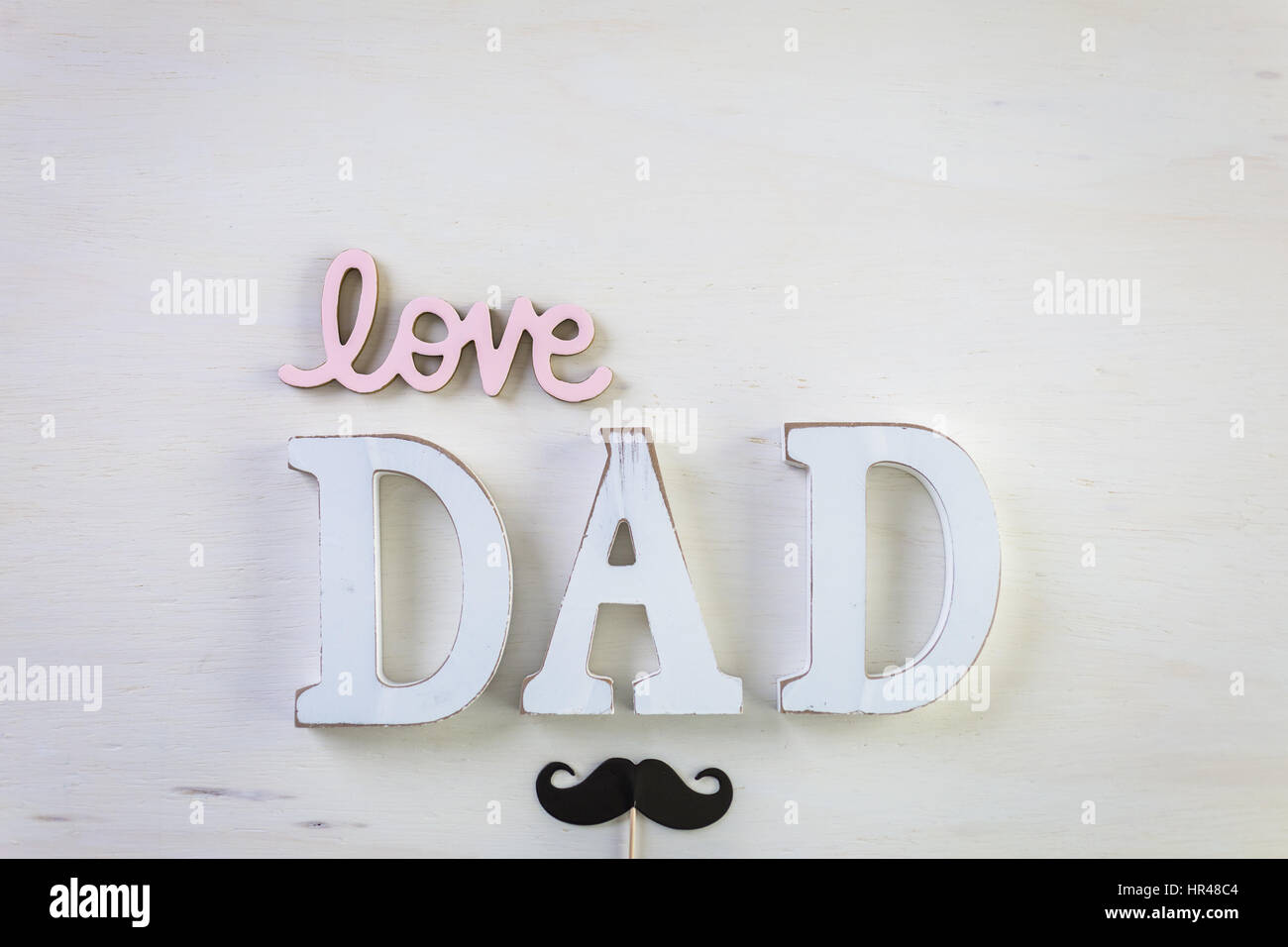 White letters DAD on a painted wood background Stock Photo - Alamy