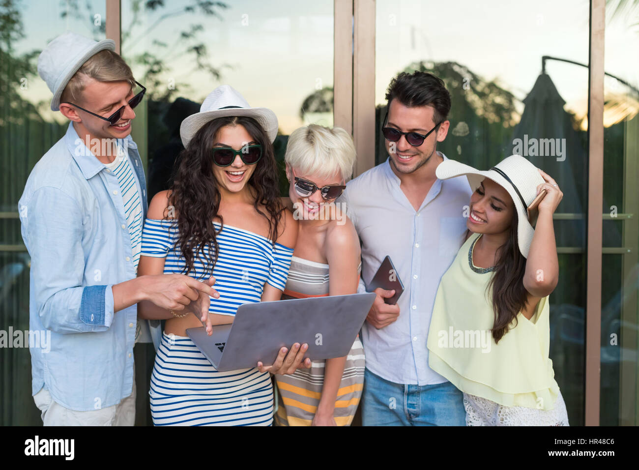 Young People Group On Terrace Tropical Hotel, Friends Using Cell Smart ...