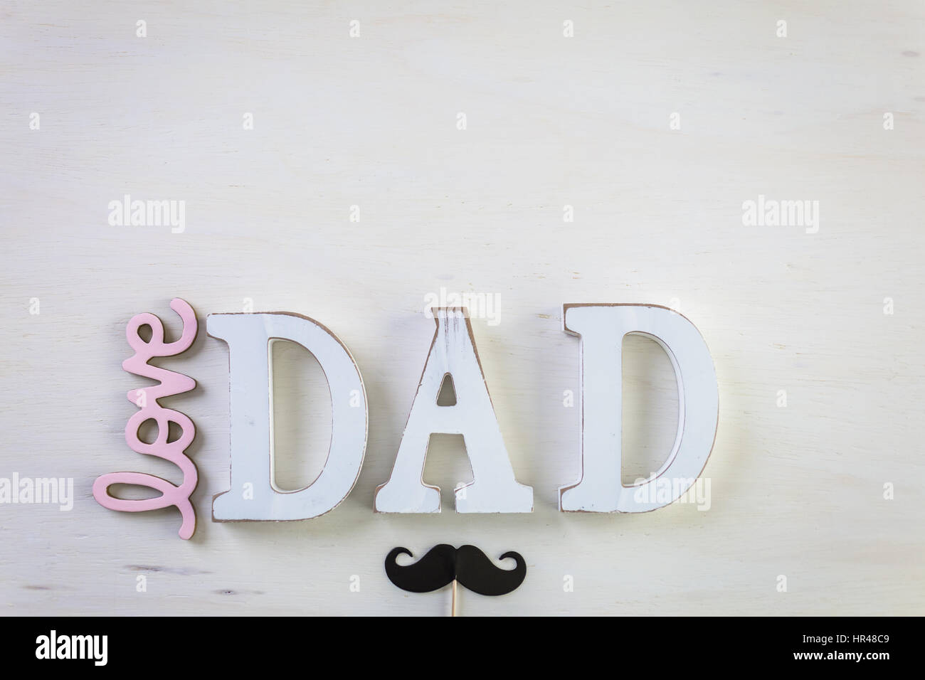 White letters DAD on a painted wood background Stock Photo - Alamy
