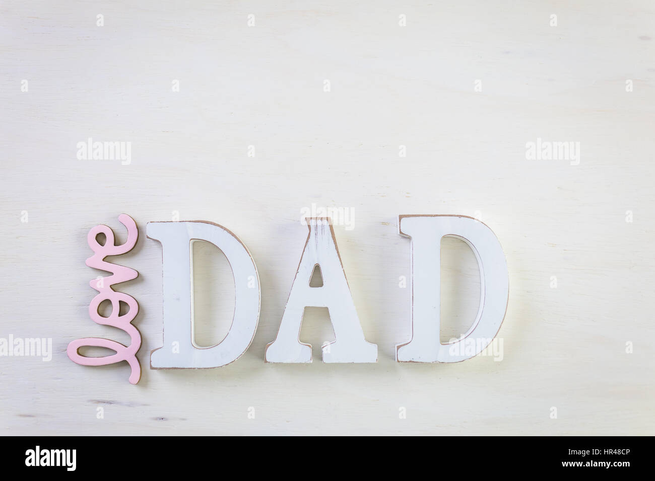 White letters DAD on a painted wood background Stock Photo - Alamy