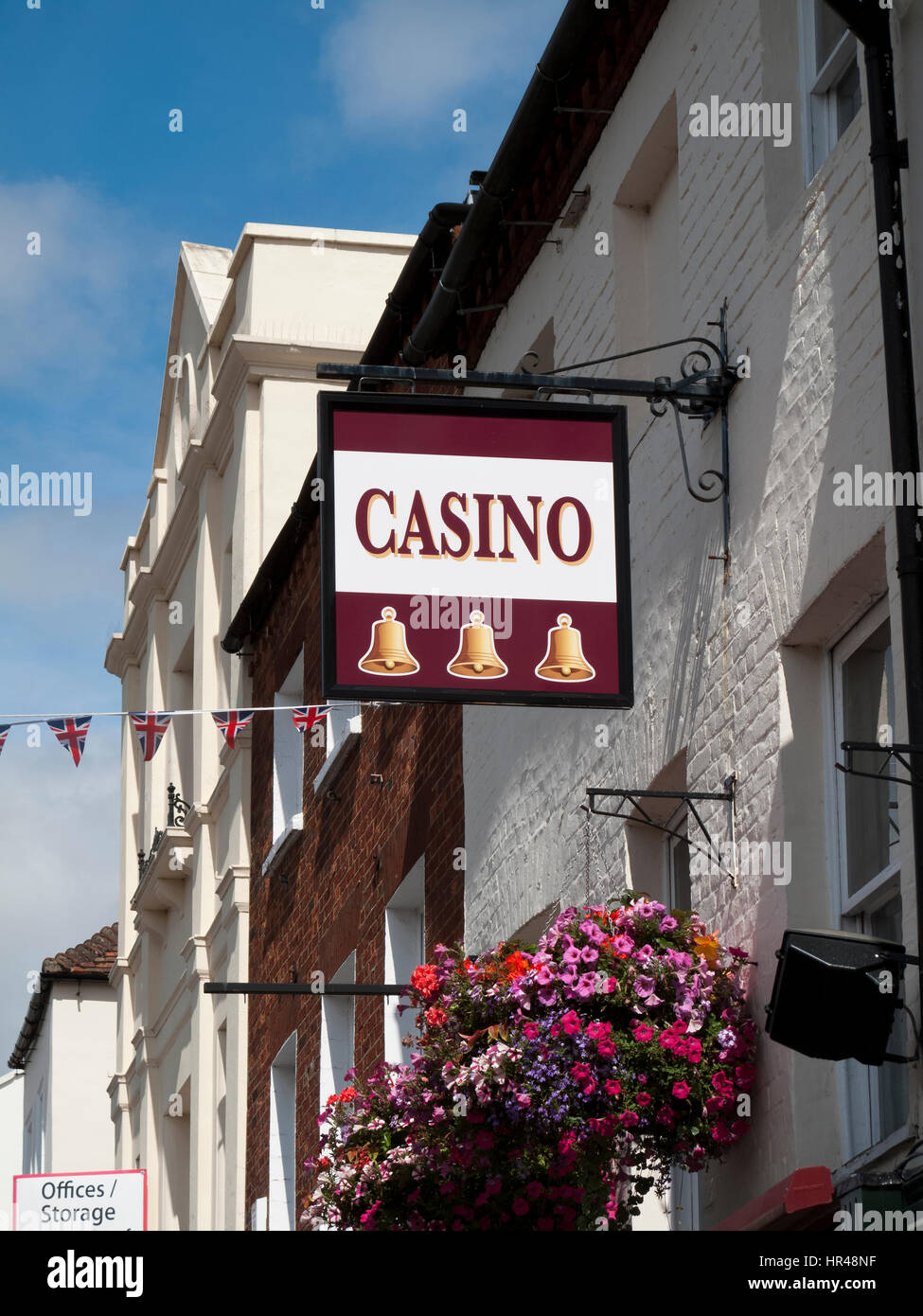 Casino sign above retail shop units Stock Photo - Alamy