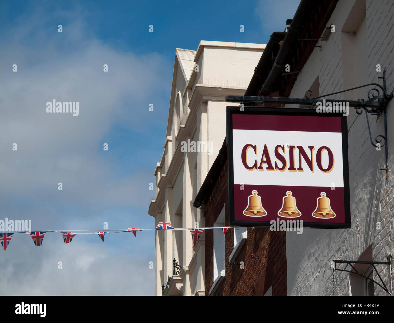 Casino sign above retail shop units Stock Photo - Alamy
