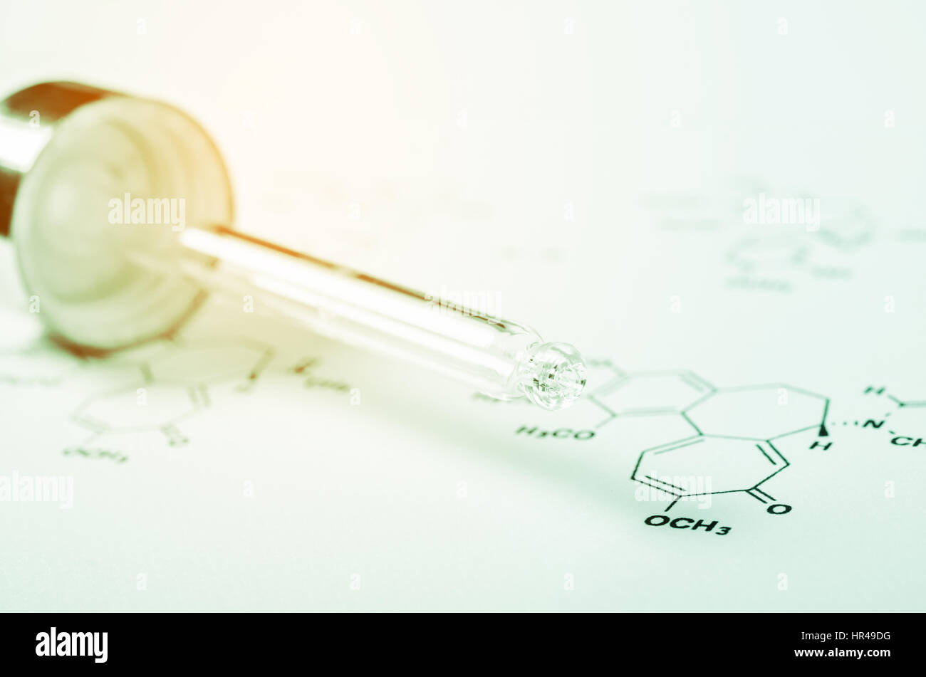 Laboratory glass Pipette on Chemical formula paper with light tone ...