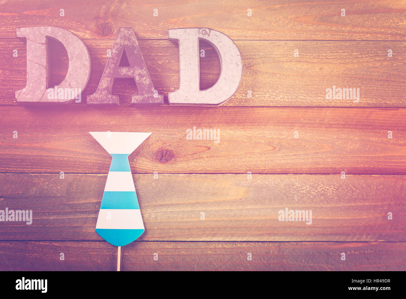 Metal letters DAD on a painted wood background Stock Photo - Alamy