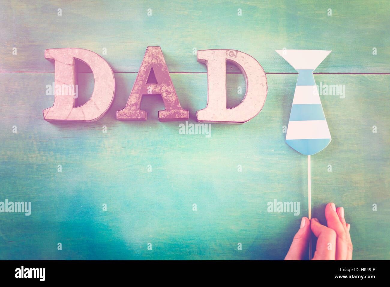 Metal letters DAD on a painted wood background Stock Photo - Alamy