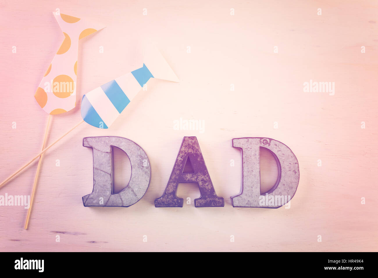 Metal letters DAD on a painted wood background Stock Photo - Alamy