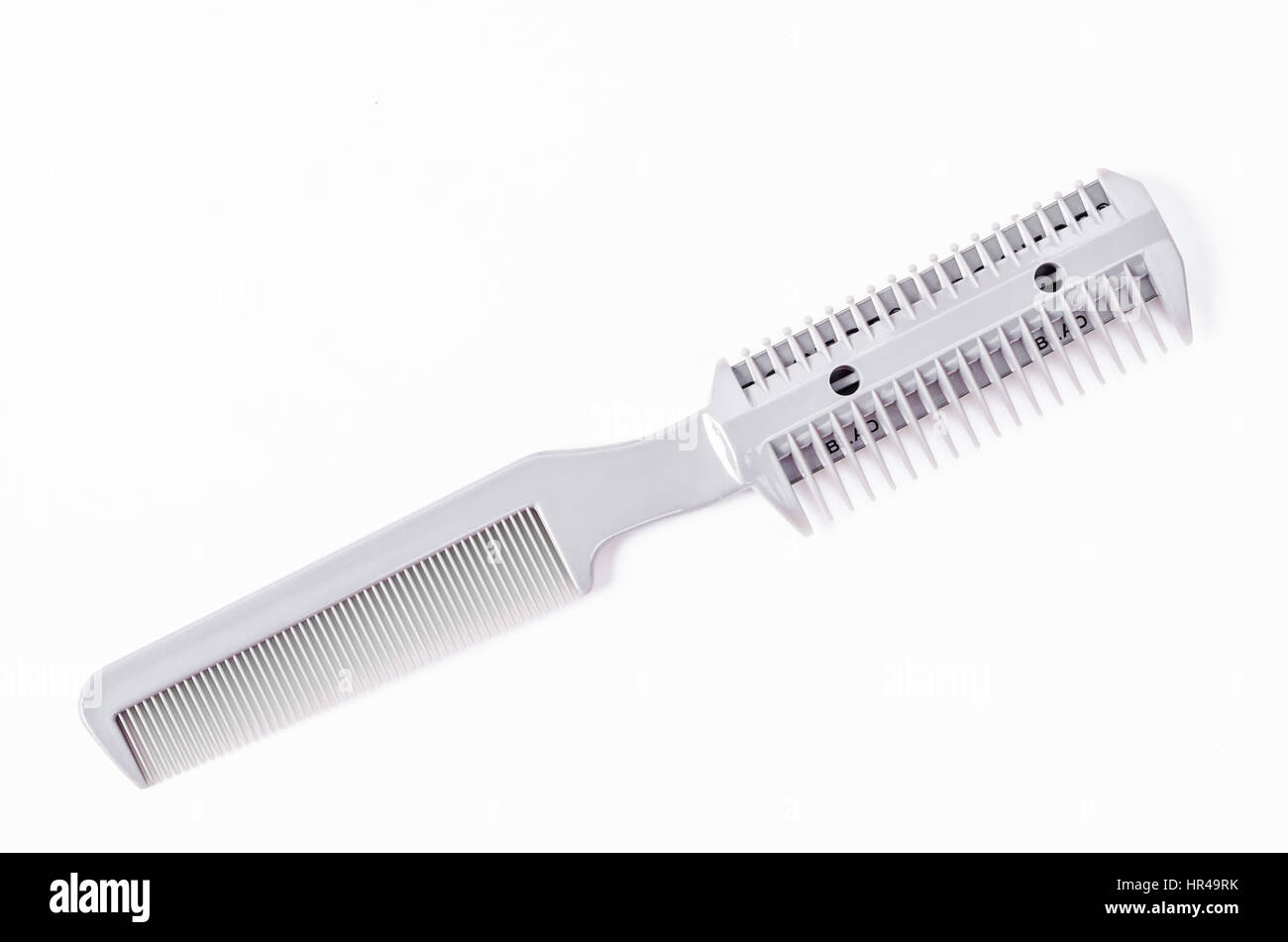 Comb slice hair with blade isolated on white background Stock Photo - Alamy