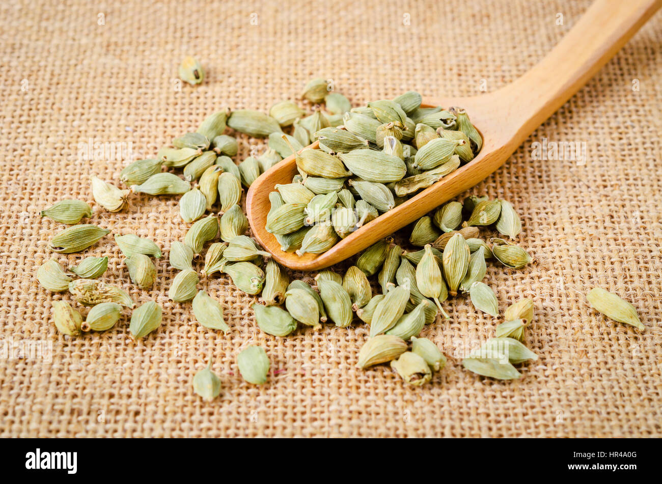 Raw Organic Cardamom Pods Ready to Use on sack background Stock Photo ...