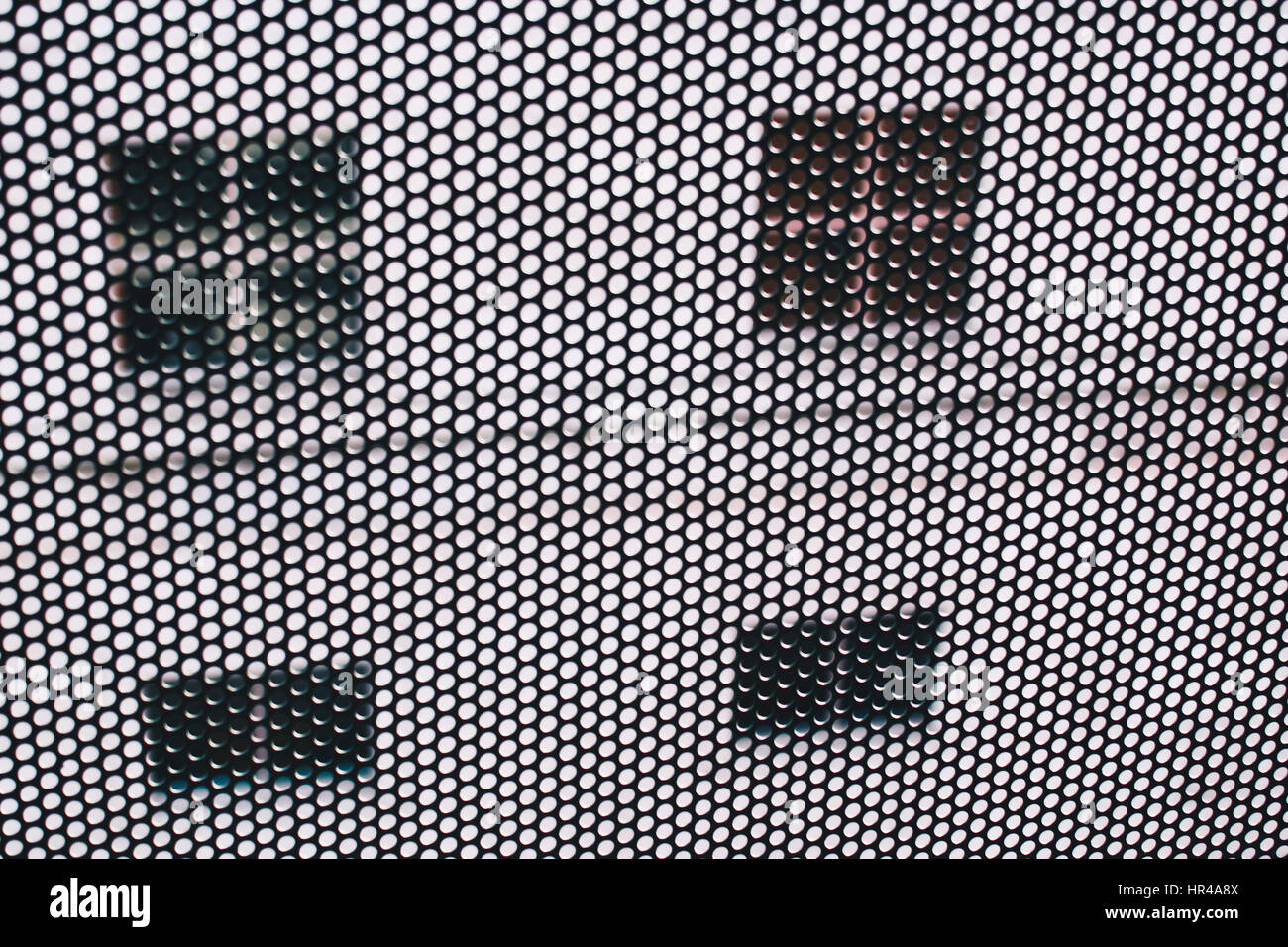 Apartment building through metal mesh Stock Photo - Alamy