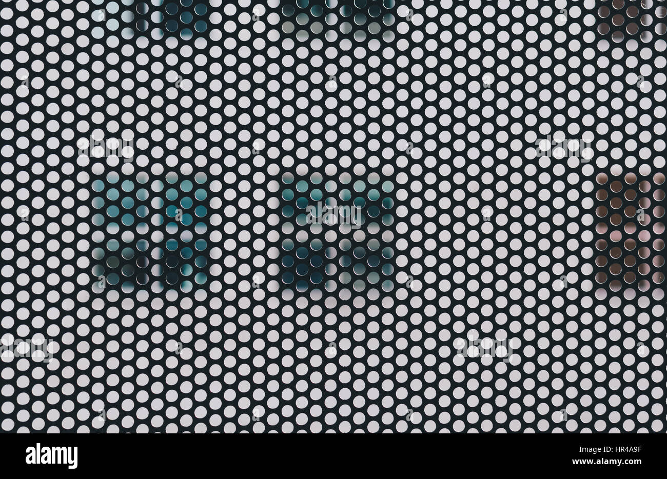 Apartment building through metal mesh Stock Photo - Alamy