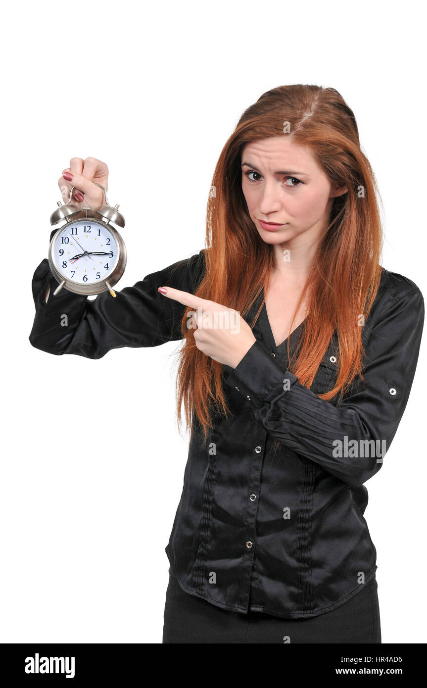 Woman counting the time on an alarm clock Stock Photo - Alamy