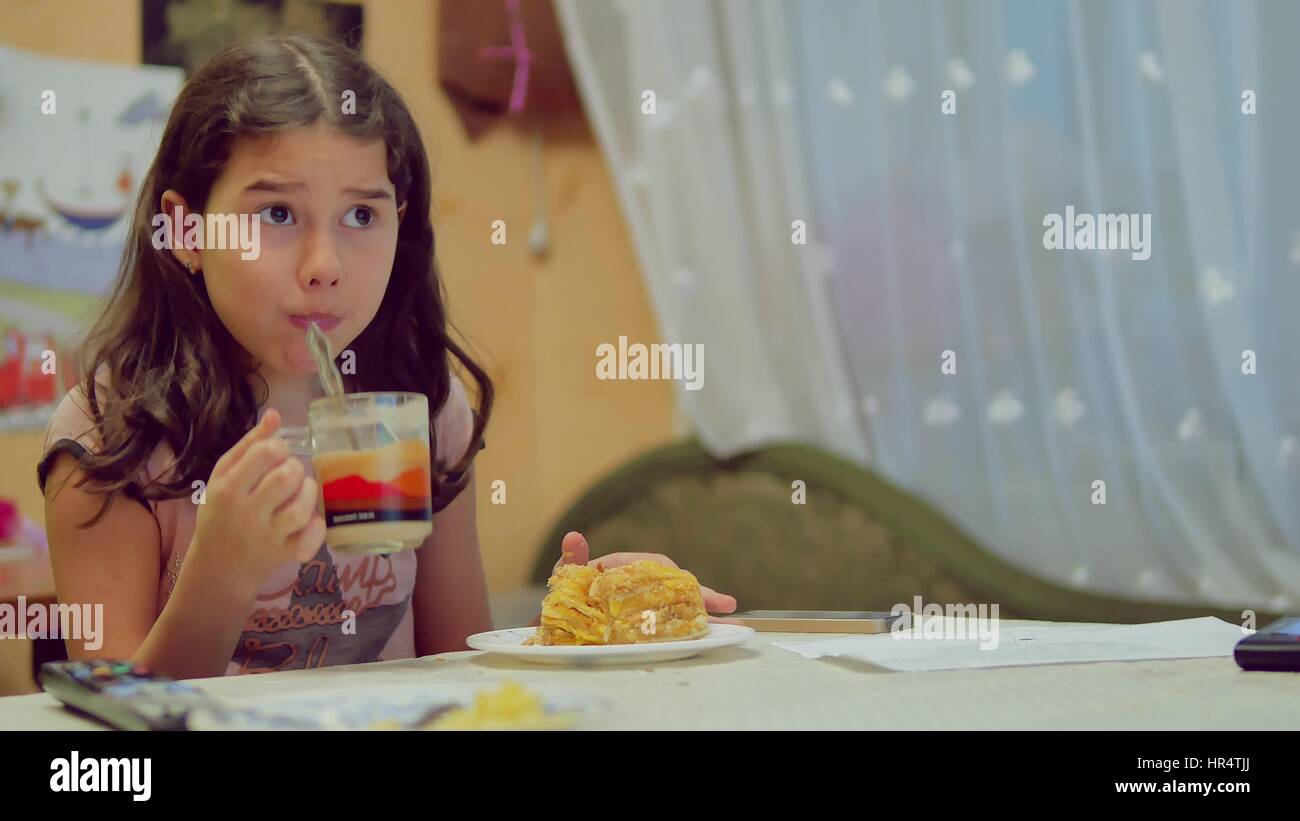 Teen girl drinking tea eating hi-res stock photography and images - Alamy