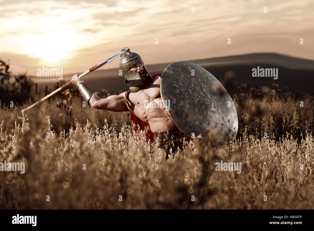 War god. Sepia toned shot of a muscular strong Roman legionary warrior ...