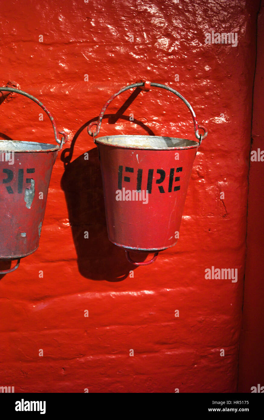 Red fire buckets Stock Photo - Alamy