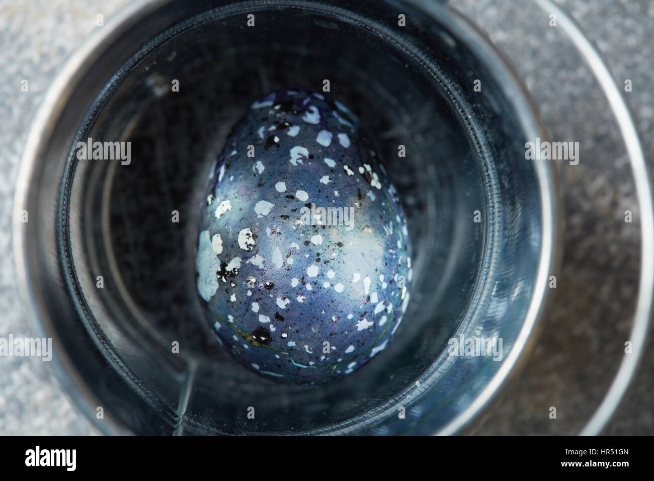 painted egg in metal bucket on a concrete background, flat lay Stock ...