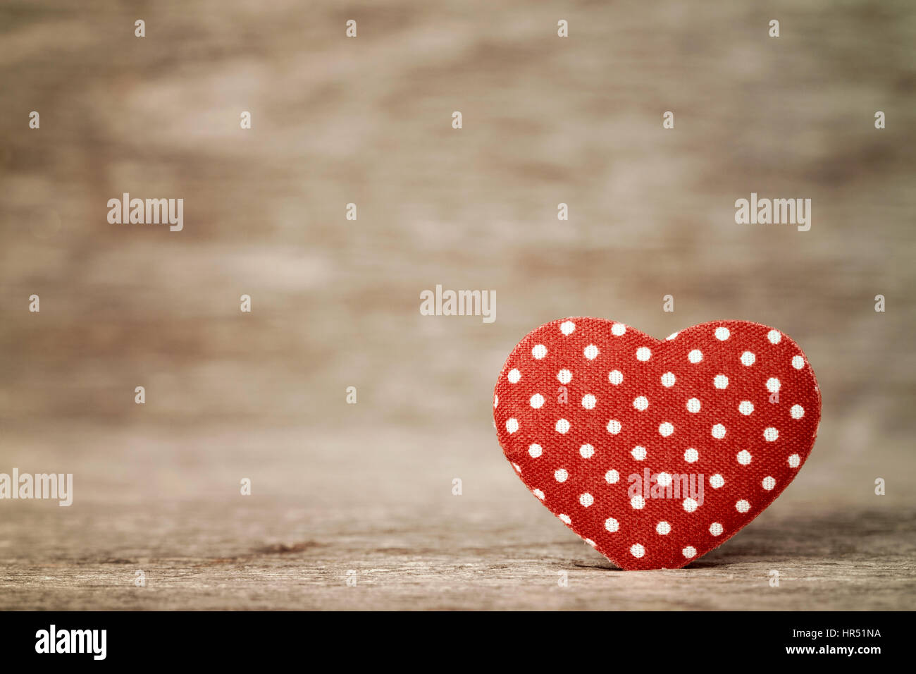 Red polka dot heart on wooden background Stock Photo - Alamy