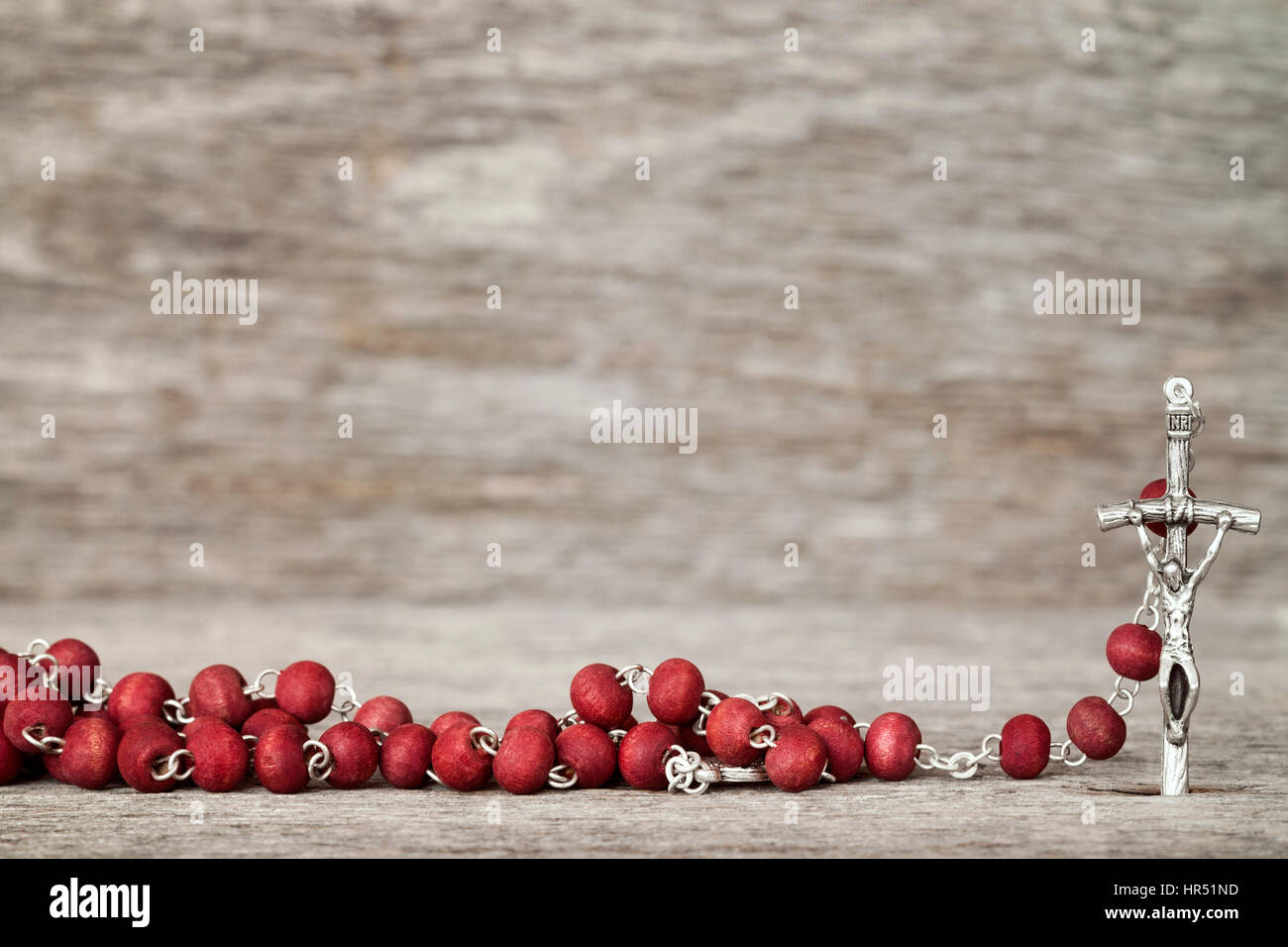 Close-up view of catholic rosary on wooden texture background Stock ...