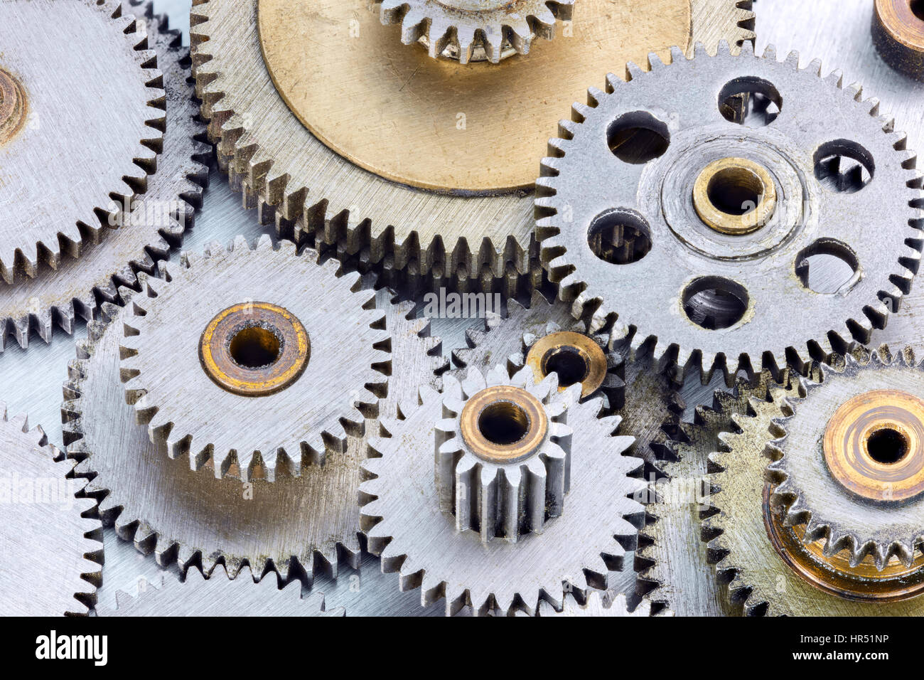 metal cogwheels for machinery on industrial scratched background Stock ...