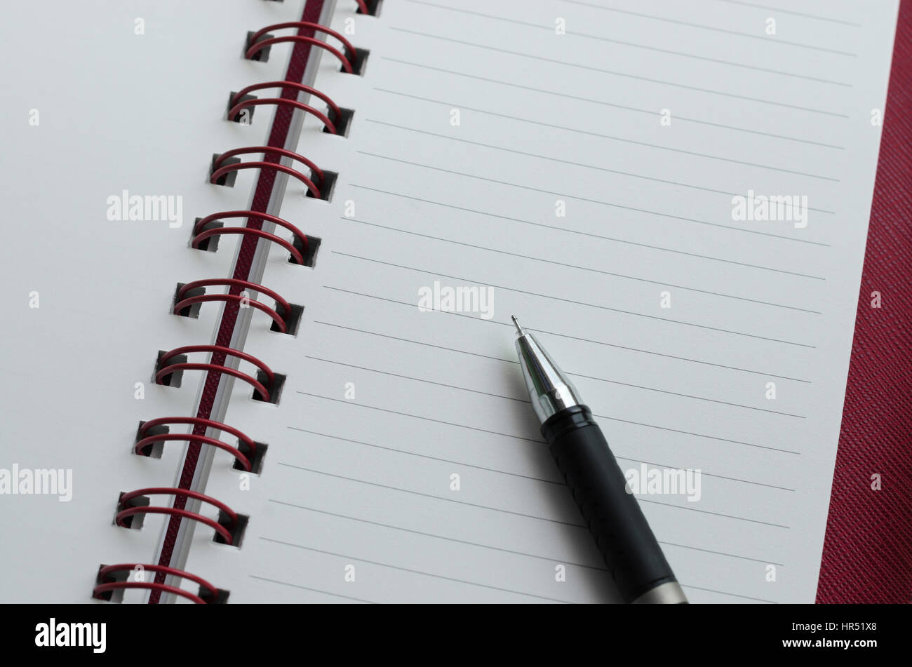 Wirebound Notebook with Blank White Paper and Pen Stock Photo - Alamy