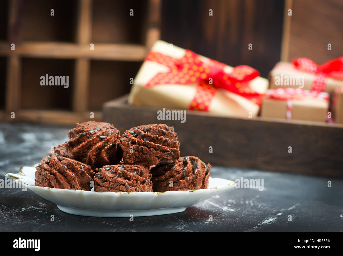 chocolate candy on plate and on a table Stock Photo - Alamy