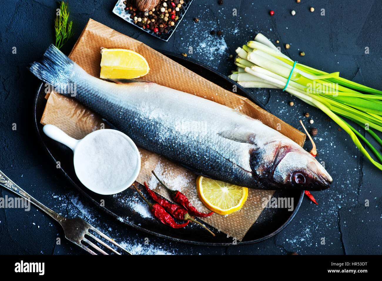raw fish with spice and fresh salad Stock Photo - Alamy