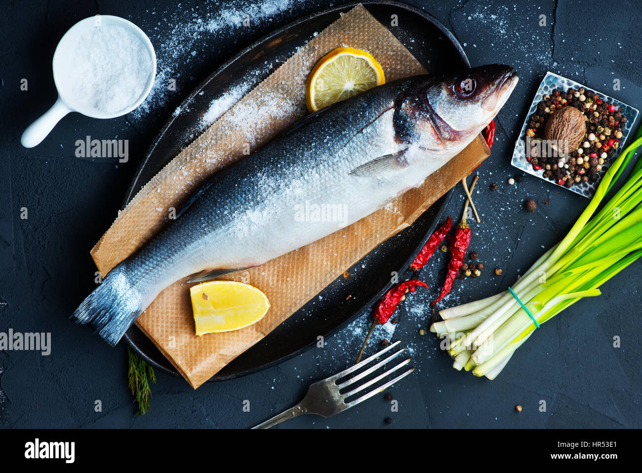 raw fish with spice and fresh salad Stock Photo - Alamy