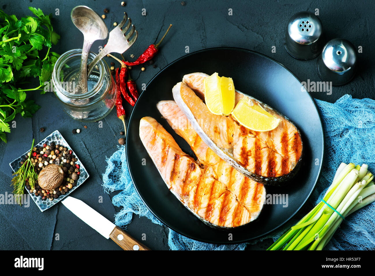 fried fish on plate and on a table Stock Photo - Alamy
