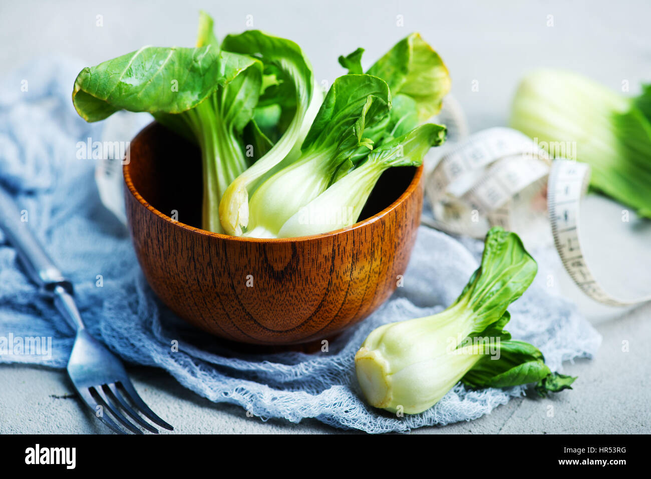 fresh pak choy in bowl and on a table Stock Photo - Alamy