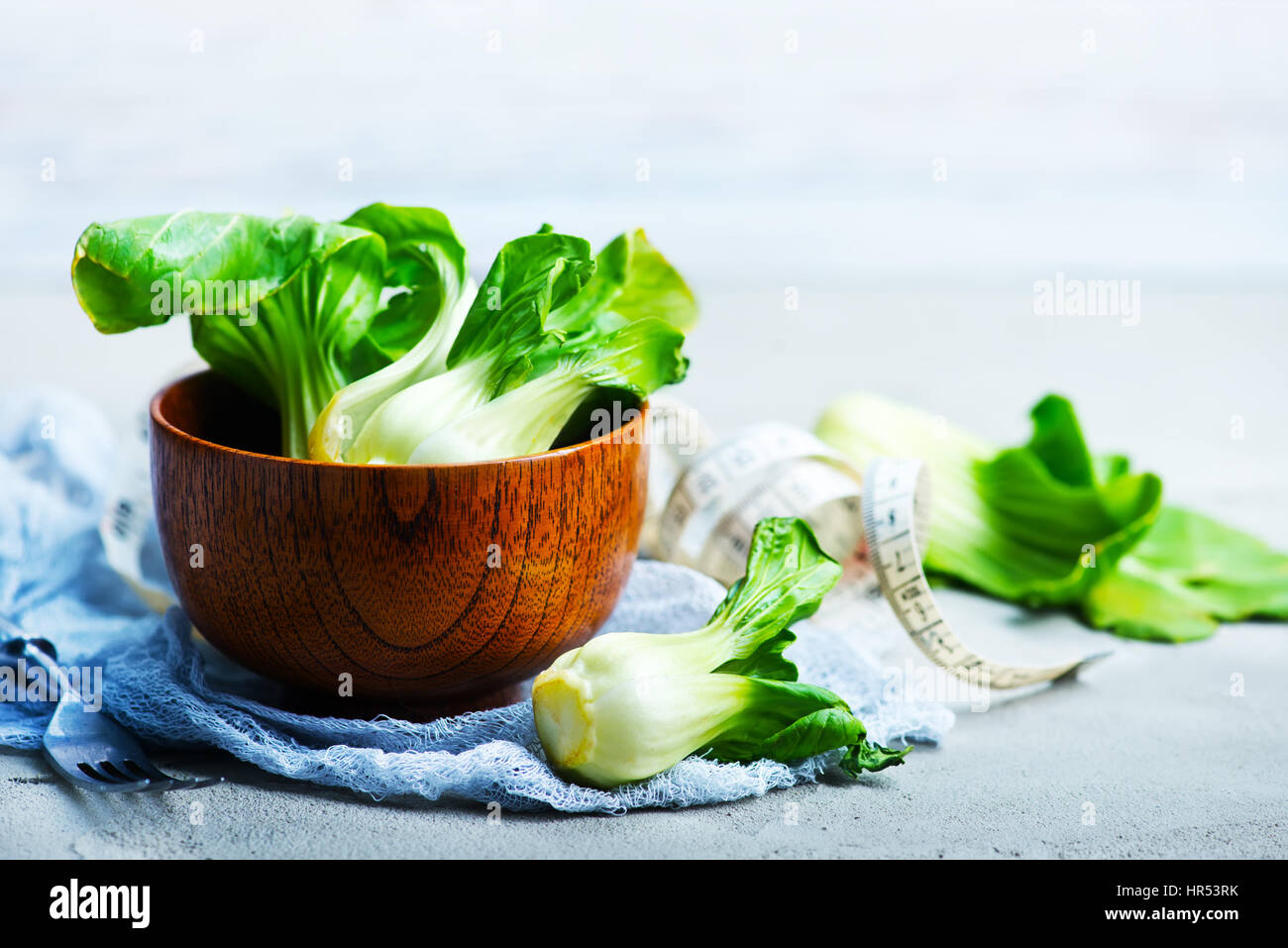 fresh pak choy in bowl and on a table Stock Photo - Alamy