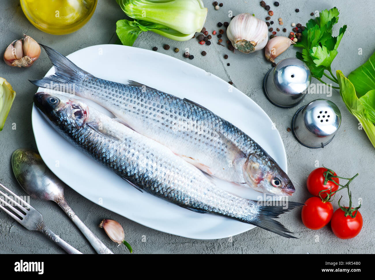 raw fish with spice and fresh salad Stock Photo - Alamy