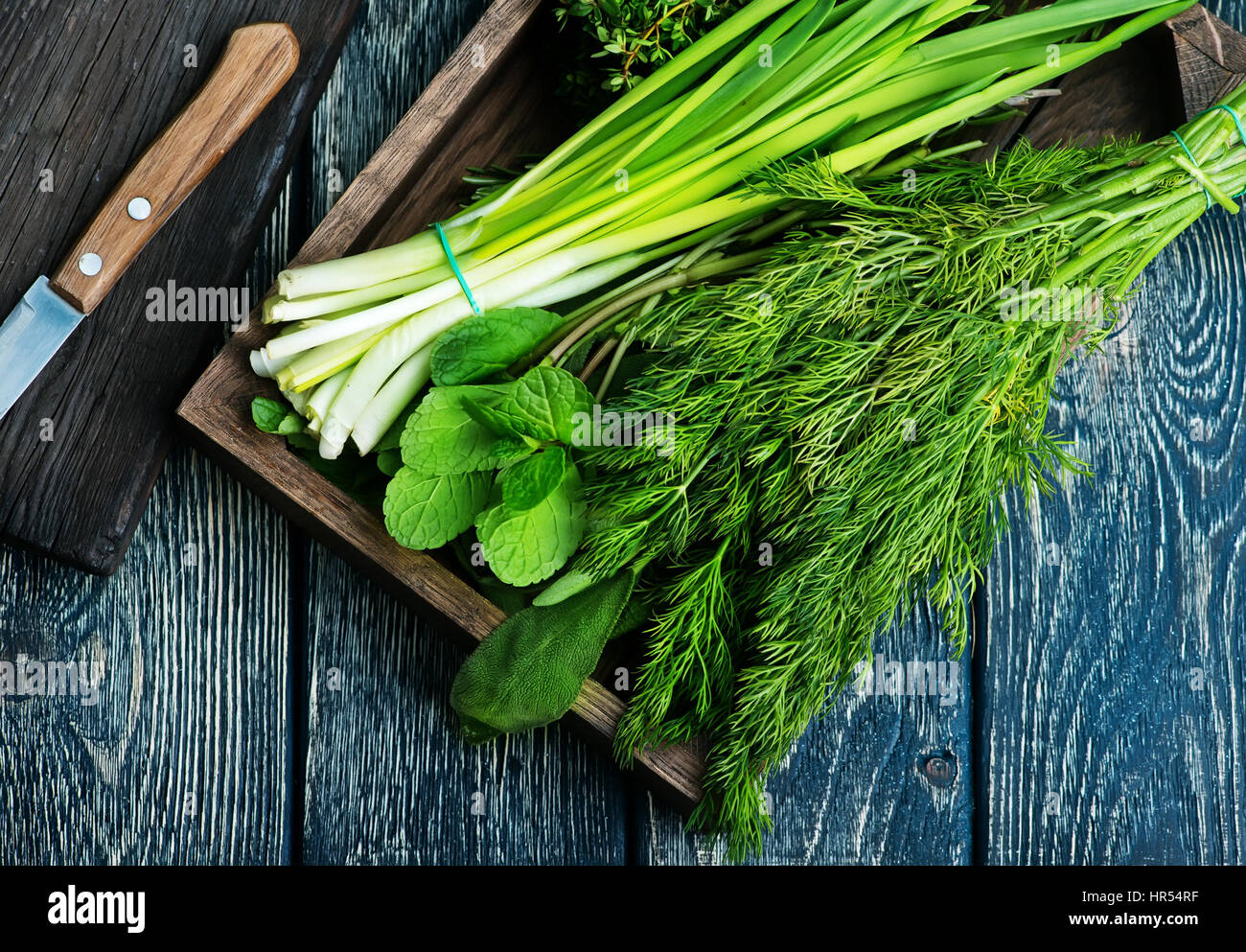 fresh greens in wooden bx and on a table Stock Photo - Alamy