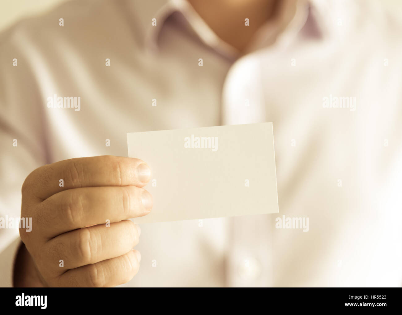 Closeup on businessman holding white empty message card with copy space ...