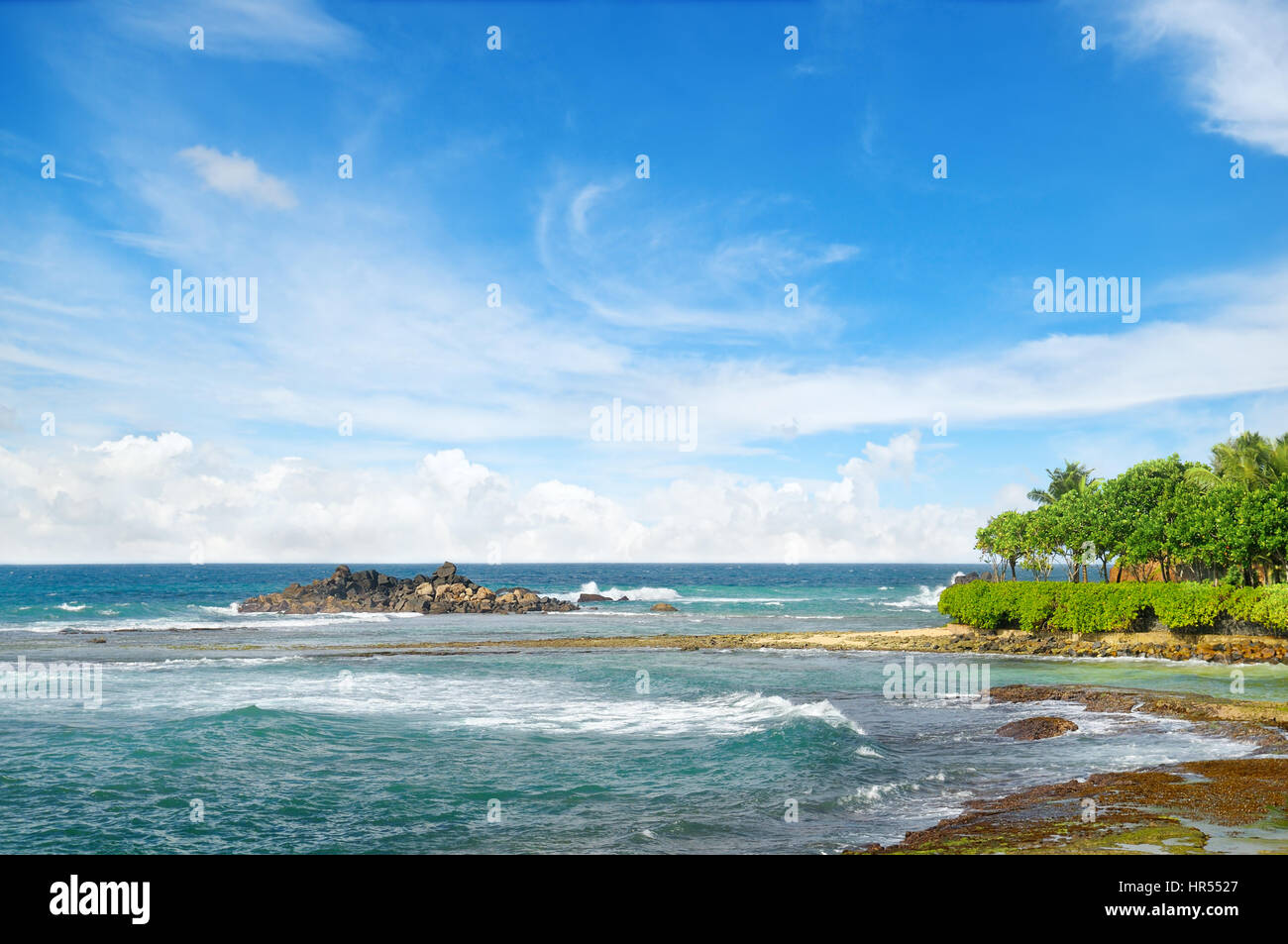 ocean, picturesque beach and blue sky Stock Photo - Alamy