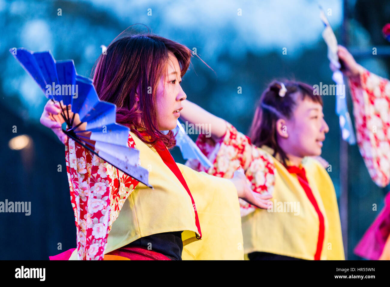 Yosakoi dance festival. Two young woman dancers in yellow yukata ...