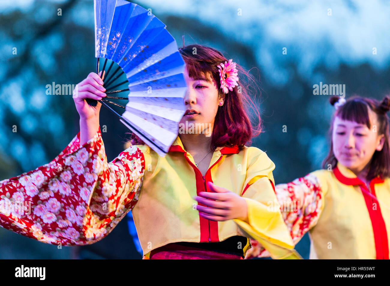 Yosakoi dance festival. Two young woman dancers in yellow yukata ...