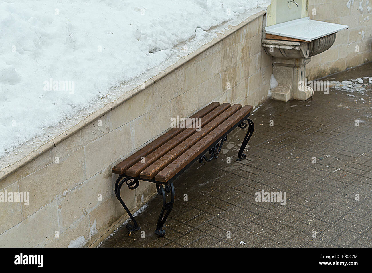 Bench standing against the wall Stock Photo - Alamy