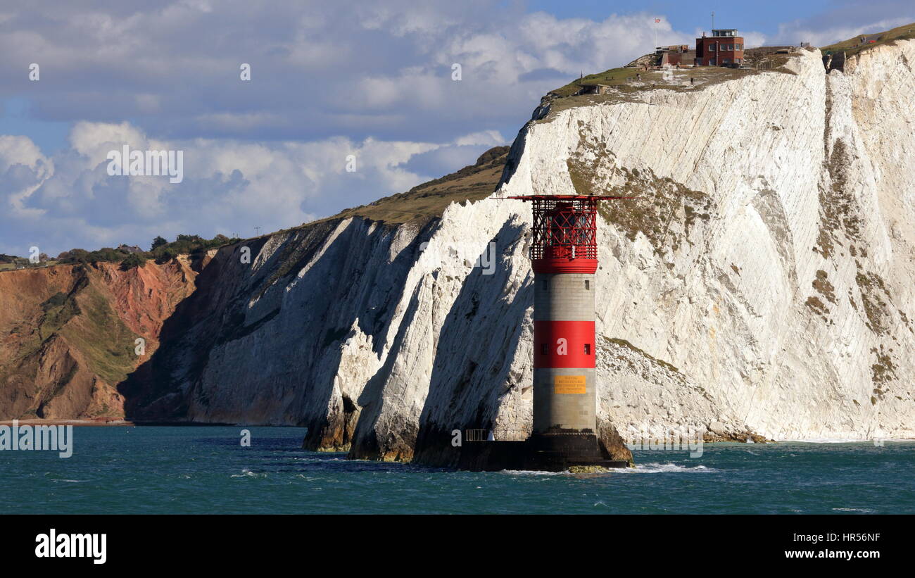 Imposing red and white Trinity Lighthouse tipping the familiar Needles ...